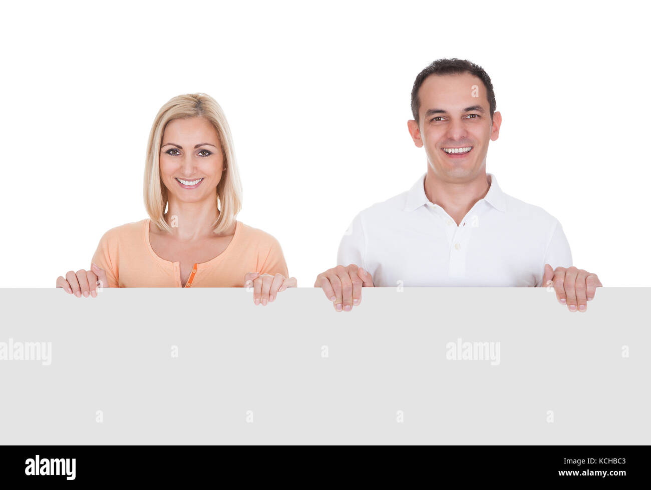 Happy Couple Holding Blank Placard Over White Background Stock Photo ... Happy Couple Holding Blank Placard Over White Background Stock Photo ...