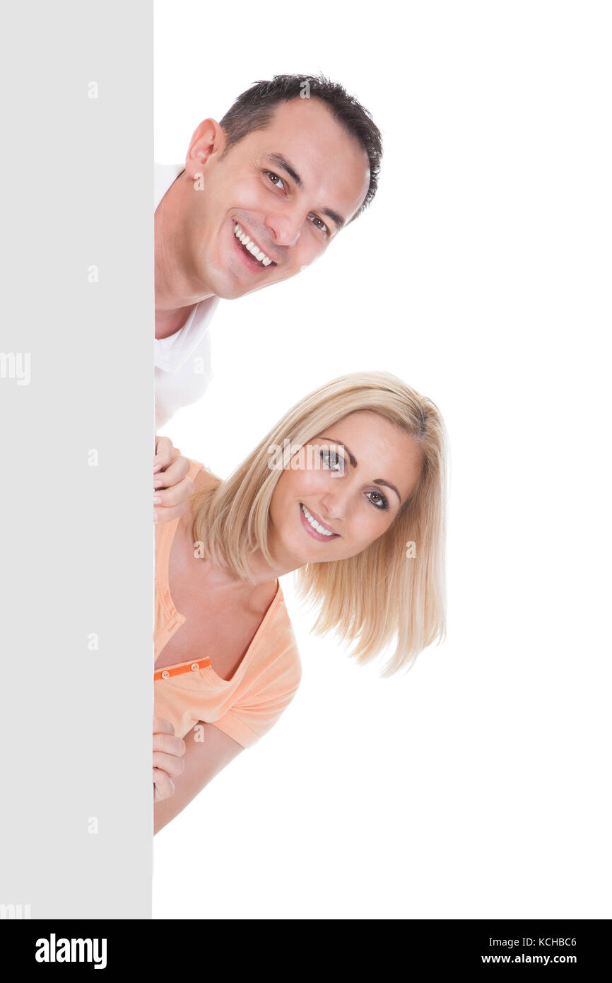 Happy Couple Holding Blank Placard Over White Background Stock Photo ... Happy Couple Holding Blank Placard Over White Background Stock Photo ...