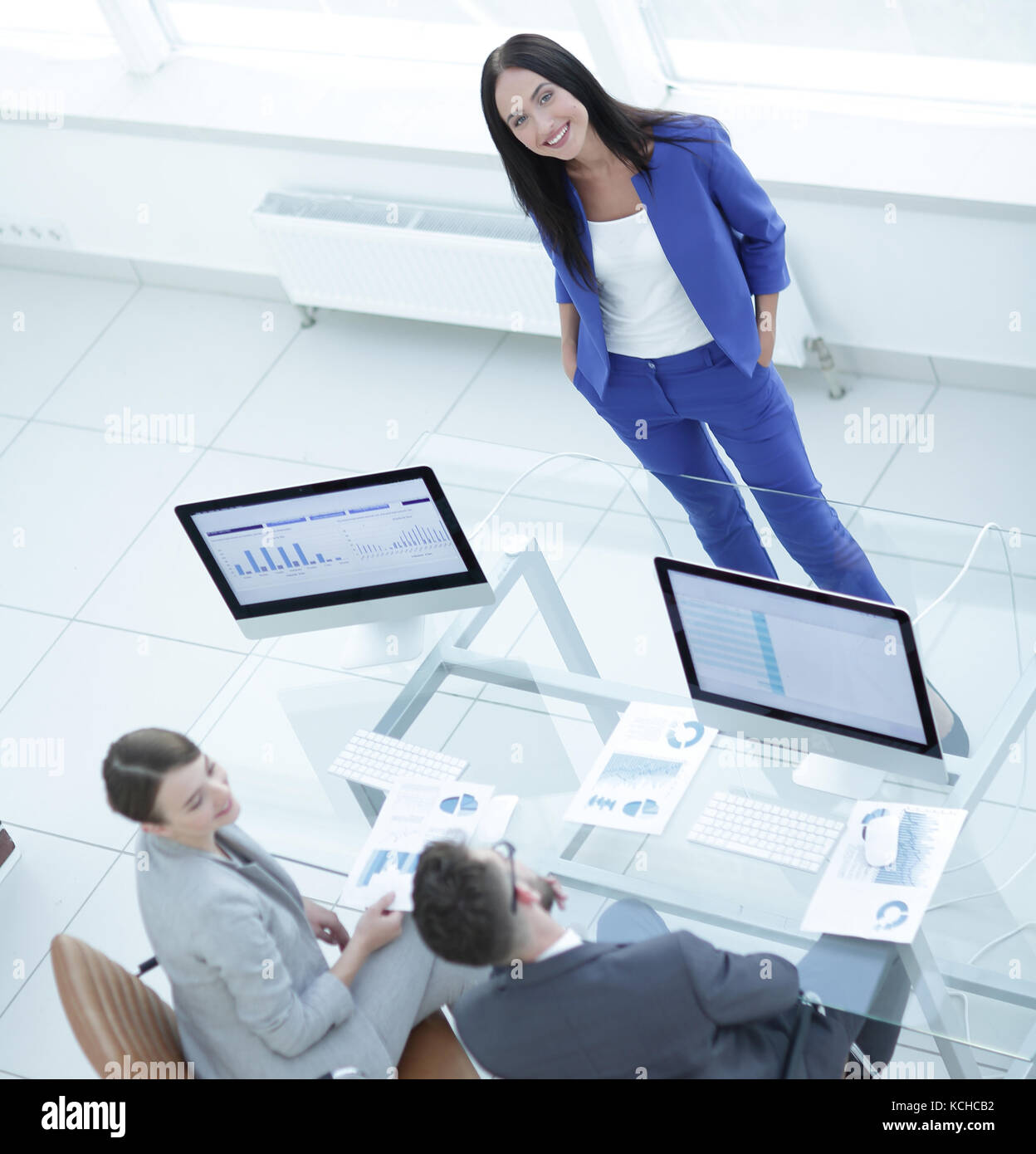 Happy project manager holds financial report, shows rising stats Stock ...