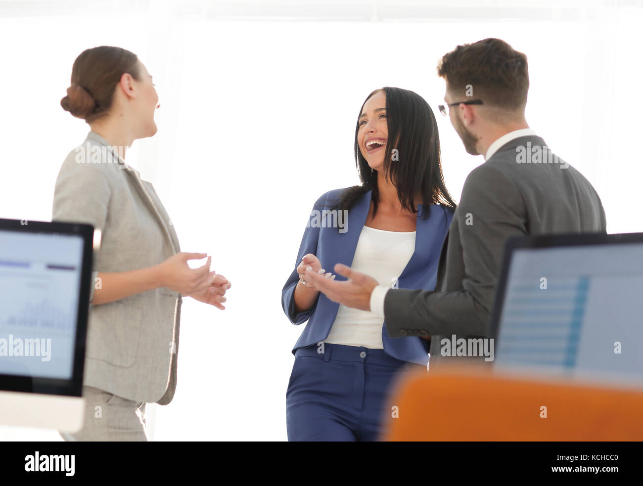 friendly business team having discussion in office Stock Photo - Alamy