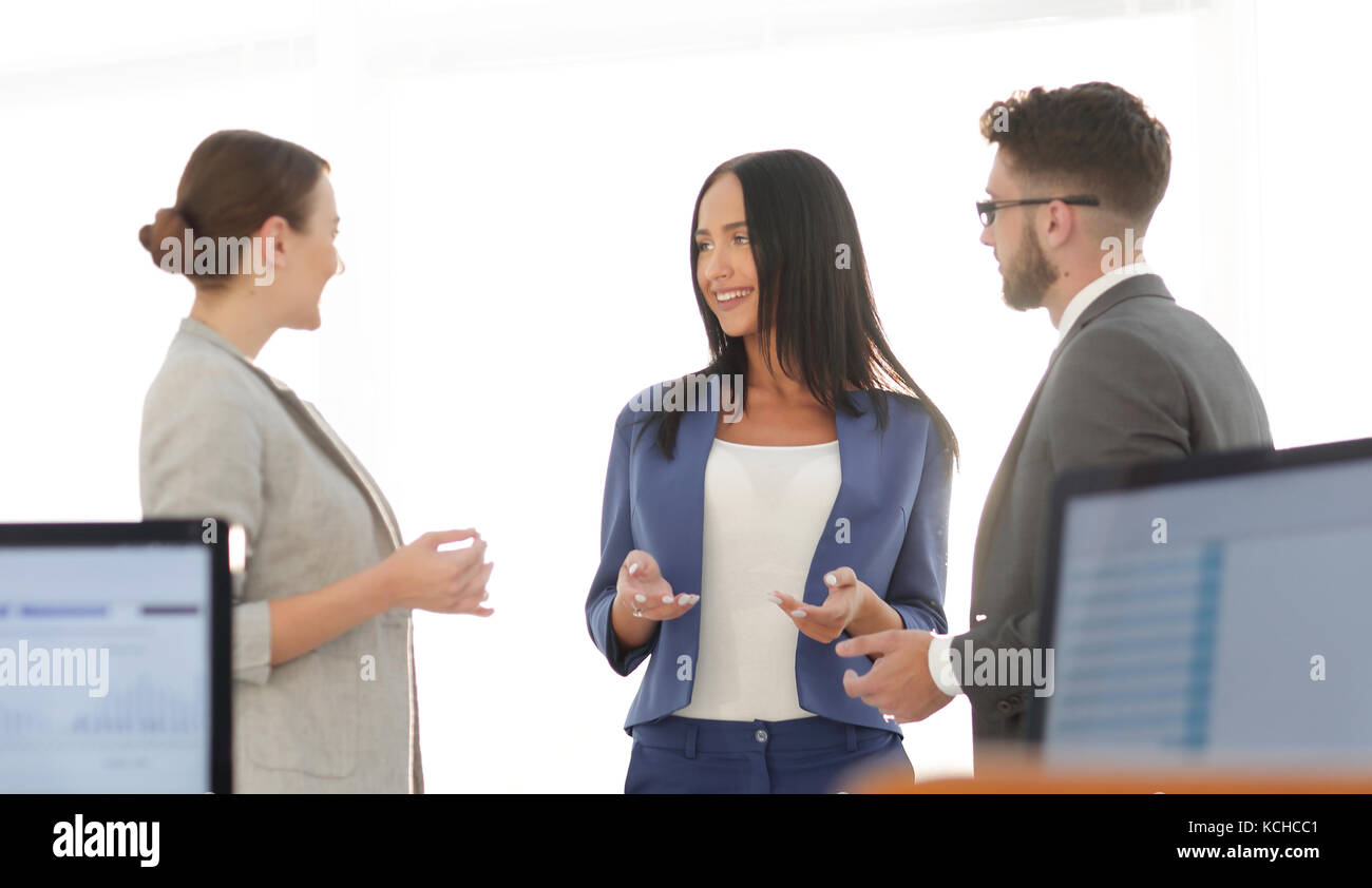 friendly business team having discussion in office Stock Photo - Alamy