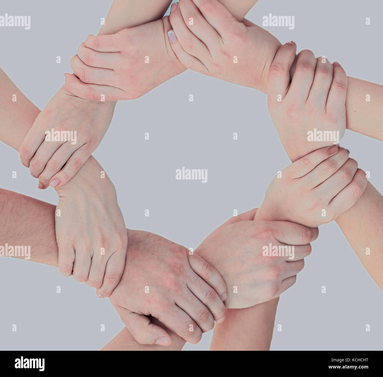 Business people joining hands in a circle in the office Stock Photo - Alamy
