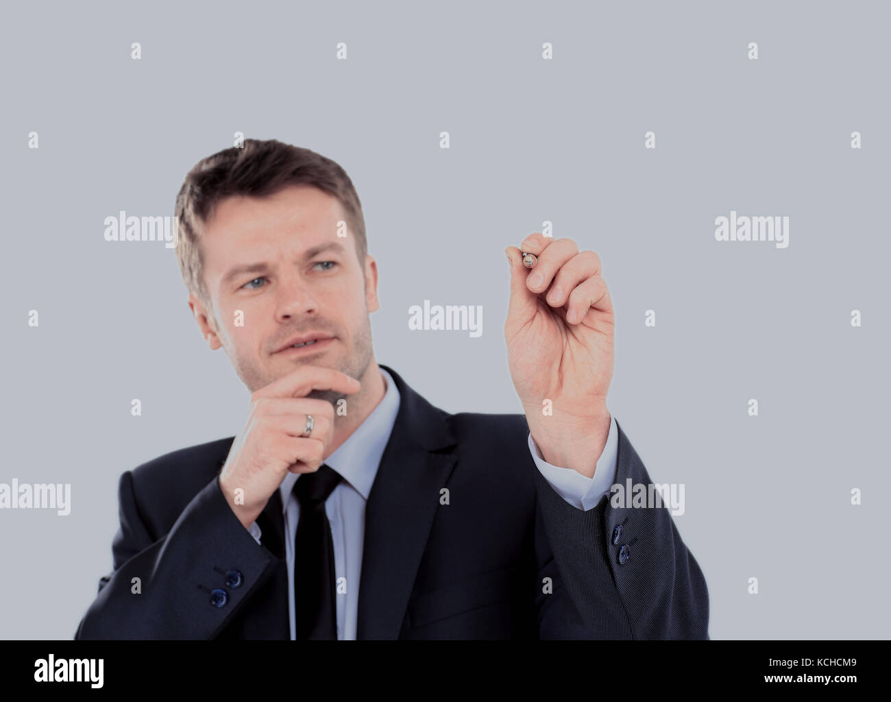 Smart business man with pen isolated on white background Stock Photo ...