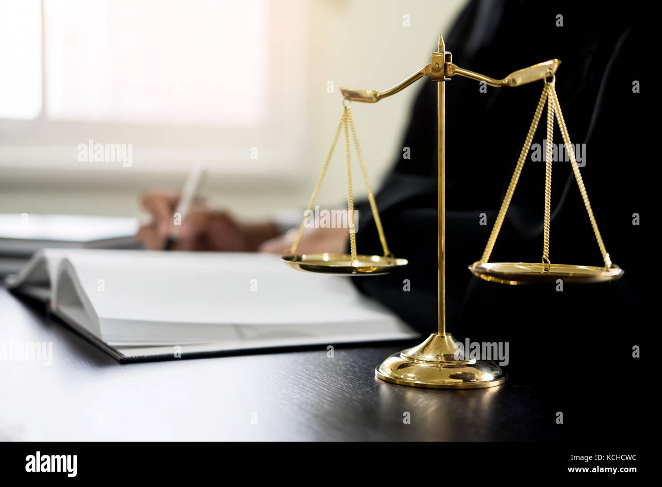 lawyer judge reading documents at desk in courtroom Stock Photo - Alamy