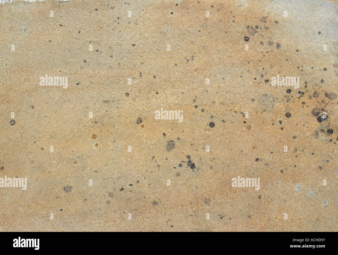 Warm color smooth stone surface as a background Stock Photo - Alamy