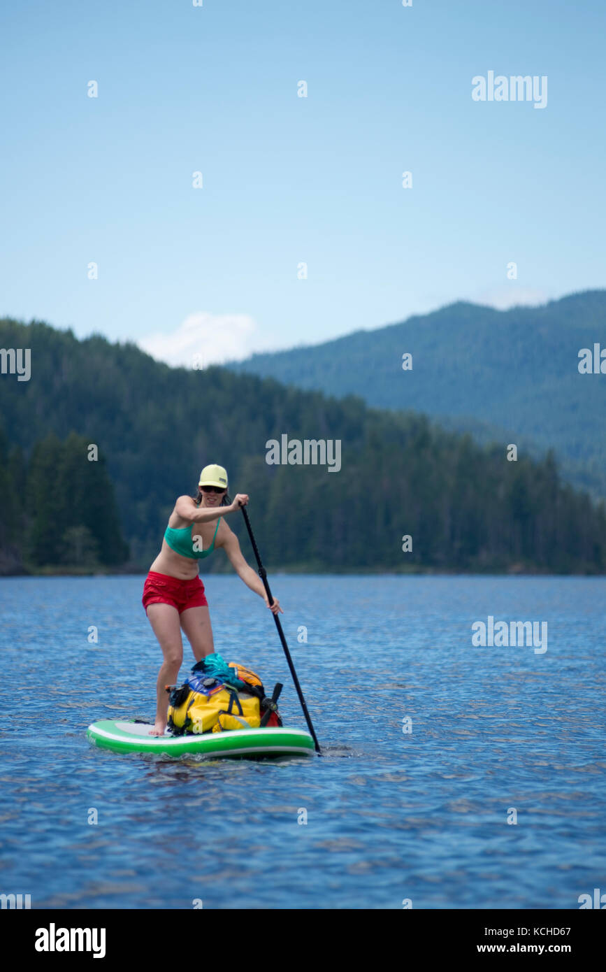 Stand up paddleboarding woman hi-res stock photography and images - Alamy