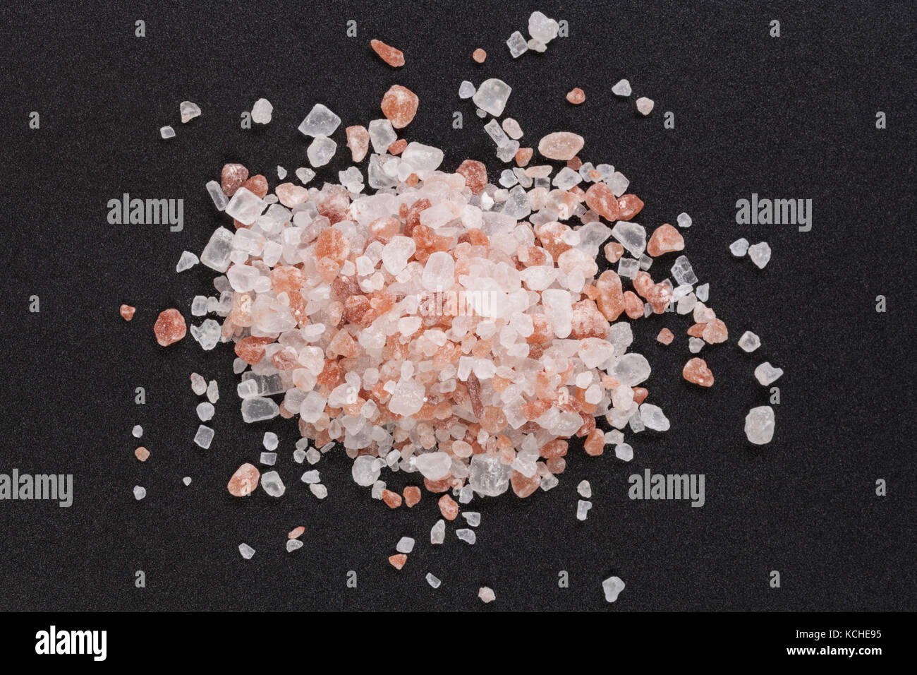 Pink Himalayan Salt Heap on Dark Gray Backroung Stock Photo - Alamy