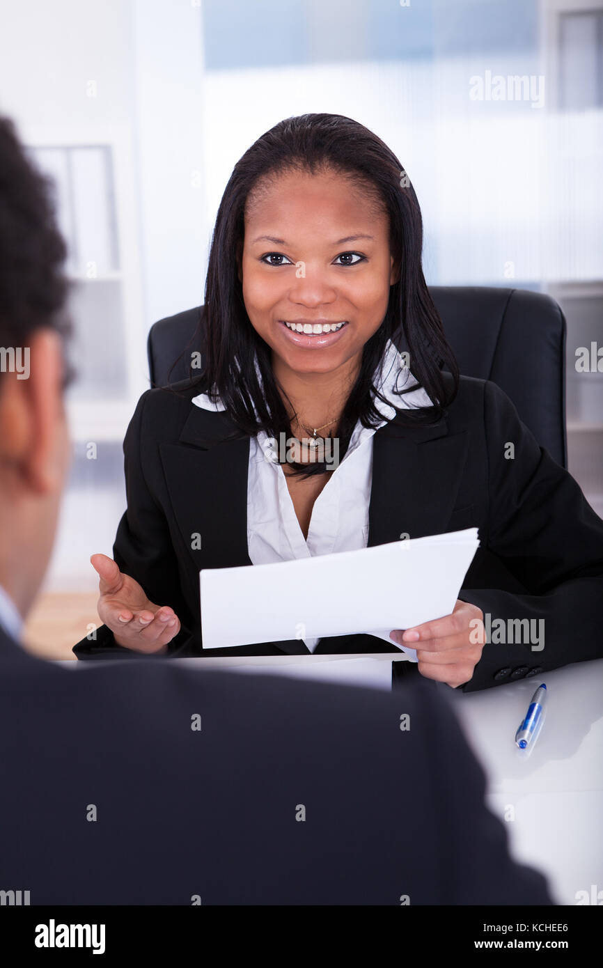 Cheerful girl sitting office table hi-res stock photography and images ...