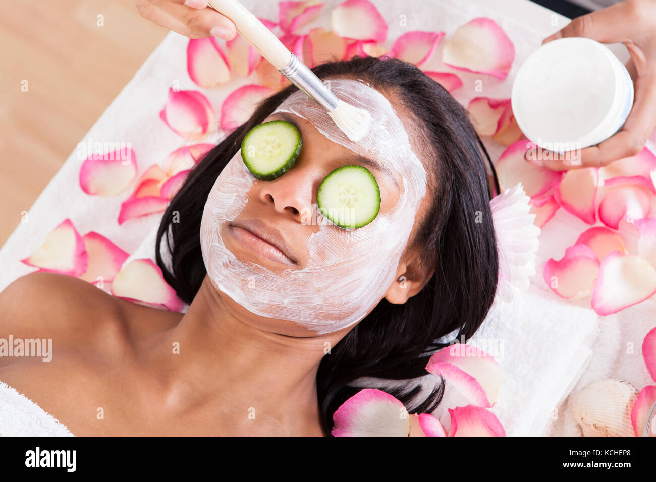 Close-up Of Woman Applying Facial Mask In Spa Stock Photo - Alamy