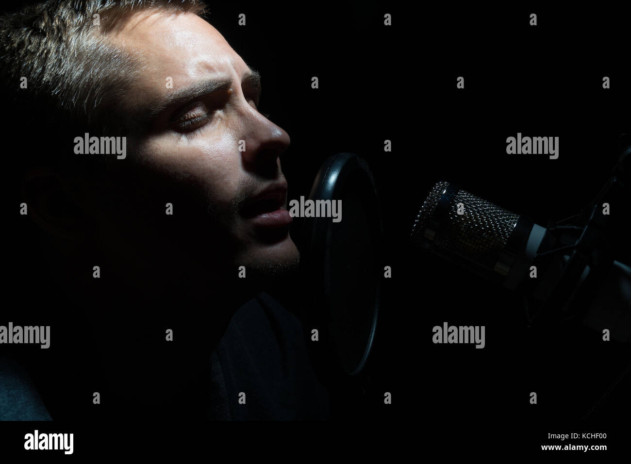 Rap musician singing in studio hi-res stock photography and images - Alamy