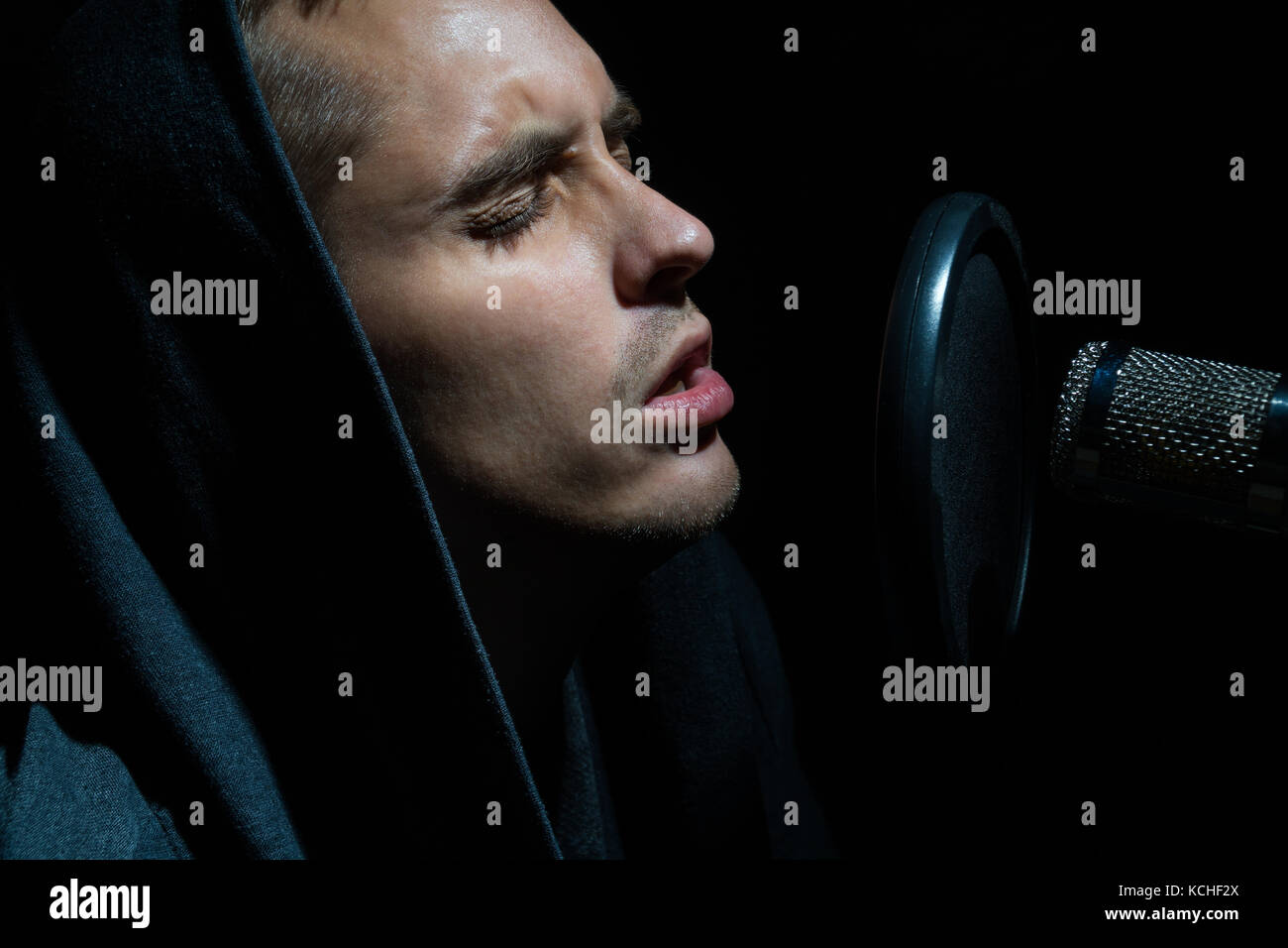 Rap musician singing in studio hi-res stock photography and images - Alamy