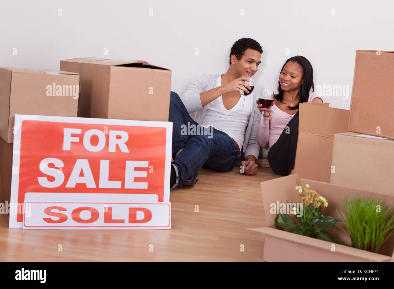 House sold sign woman hi-res stock photography and images - Alamy