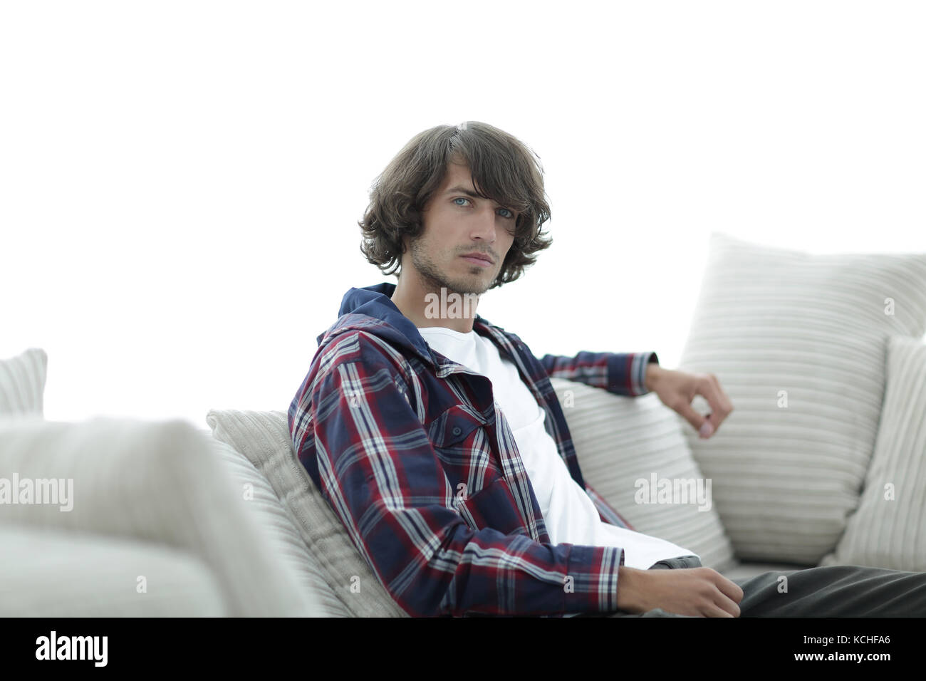 handsome successful guy sitting on the couch Stock Photo - Alamy