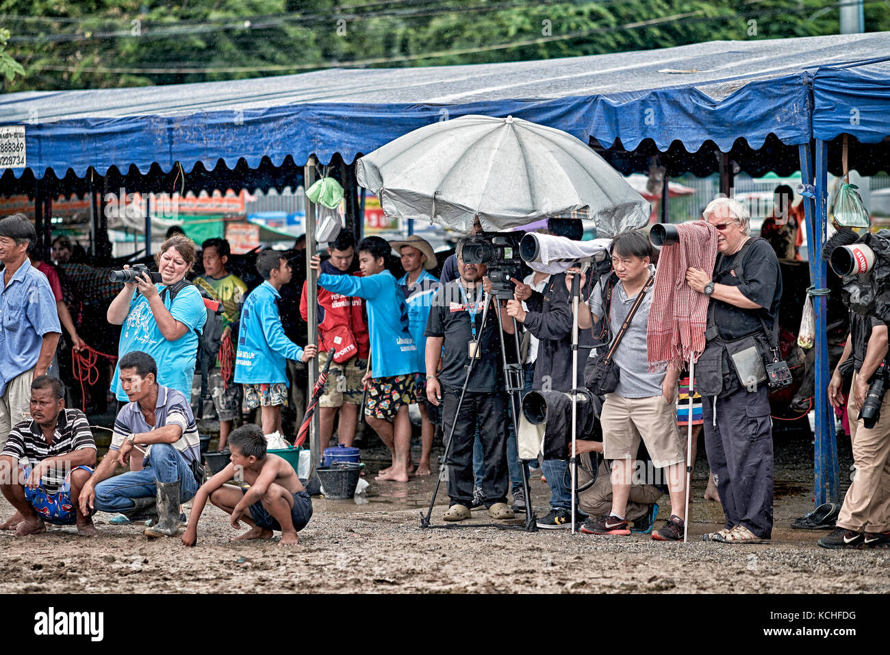 Photographers at work, on location, shooting outdoor event Stock Photo ...