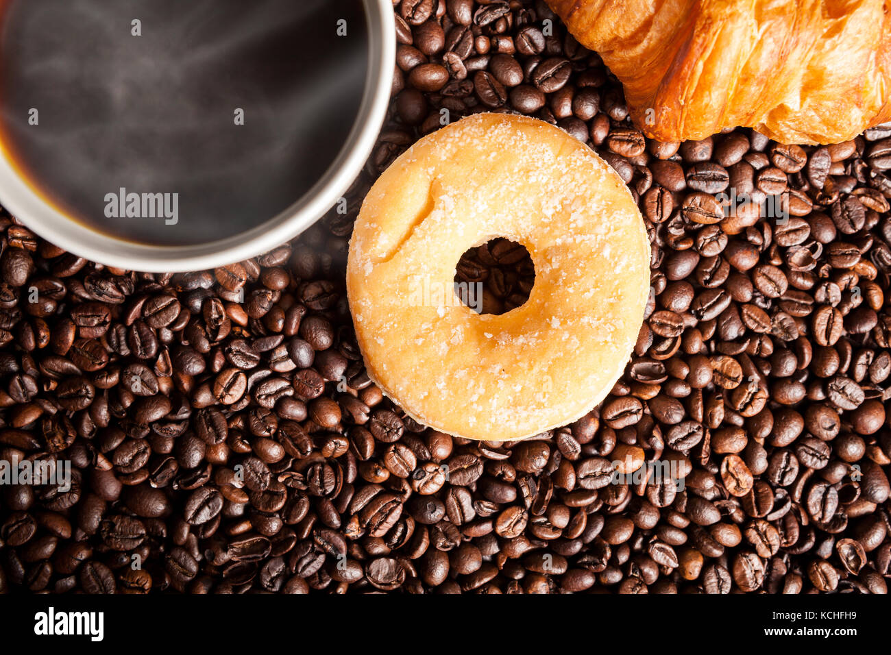 Over top view of Coffee beans, donut and a cup of coffee Stock Photo ...