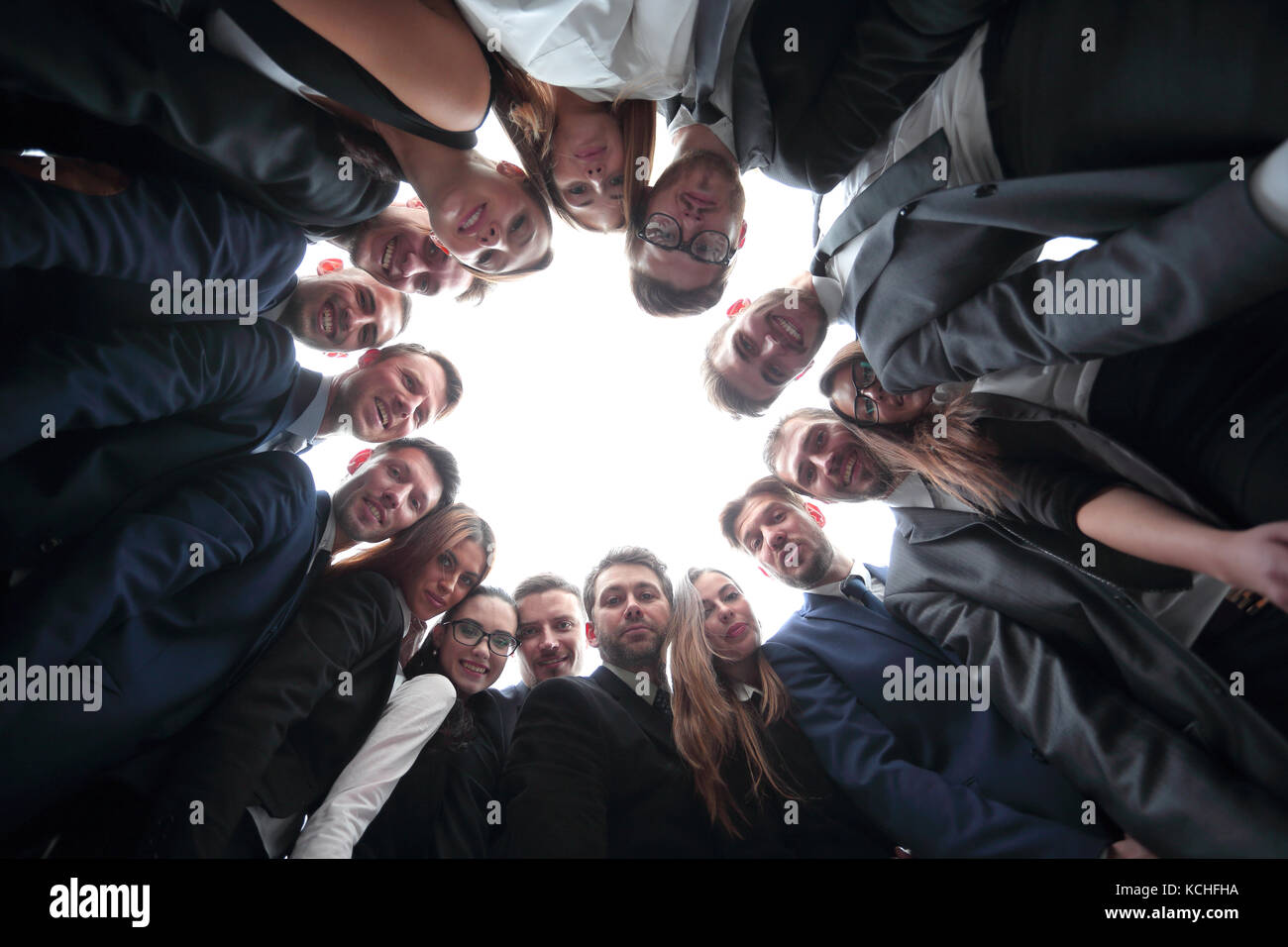 large business team is forming a circle and looking at the camera Stock ...
