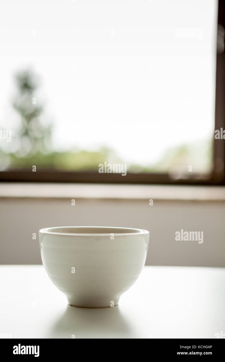 Coffee mug on a window sill Stock Photo - Alamy