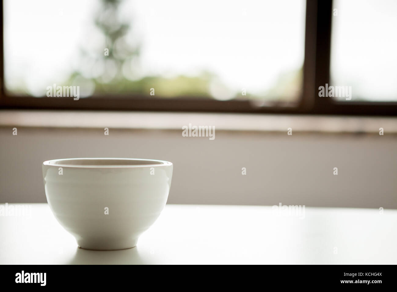 Coffee mug on a window sill Stock Photo - Alamy
