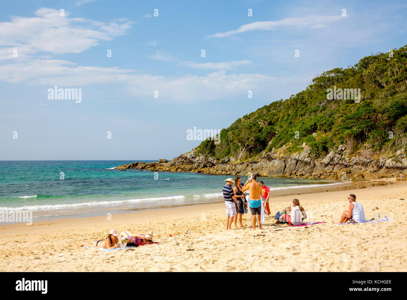 Friends relaxing on Elizabeth beach on a Spring day, one of the ...