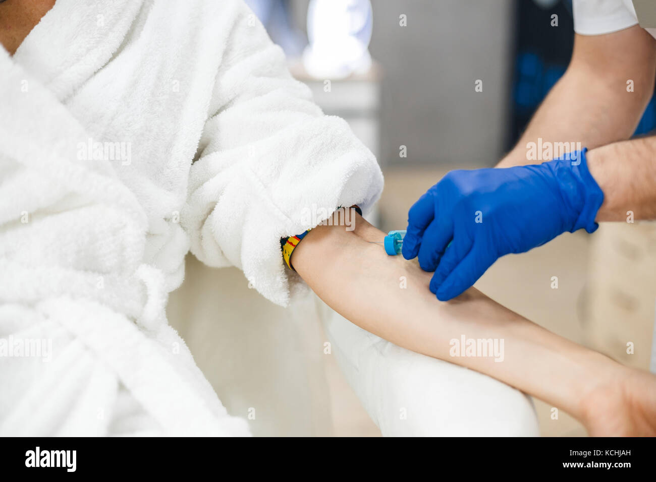 Close up view of male doctor collecting blood from patient Stock Photo ...