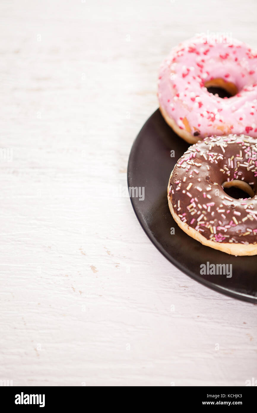 Plate with donuts next to window Stock Photo - Alamy