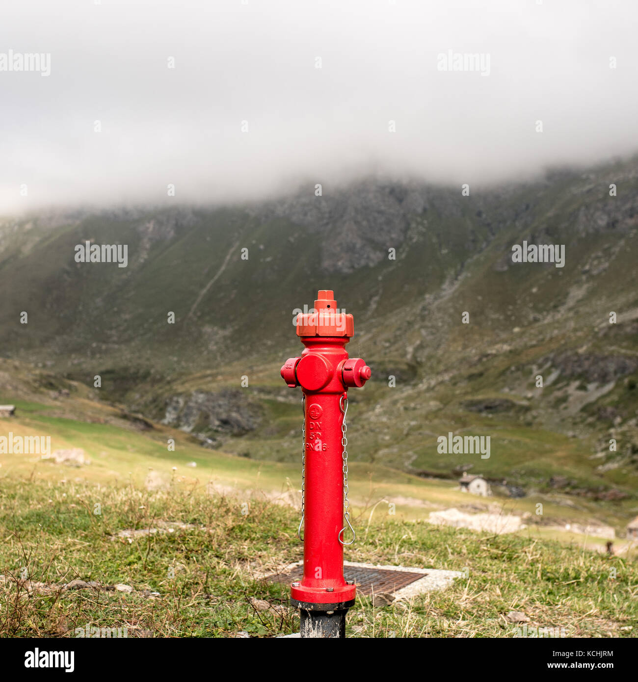 fire hydrant in alpine scene, mountains landscape in background Stock ...