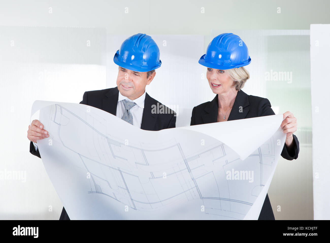 Two engineers looking at computer hi-res stock photography and images ...
