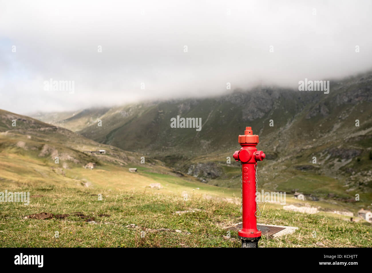 fire hydrant in alpine scene, mountains landscape in background Stock ...