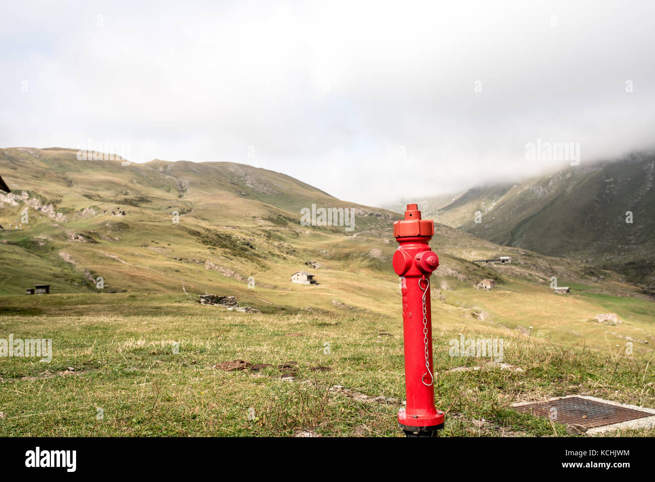 fire hydrant in alpine scene, mountains landscape in background Stock ...