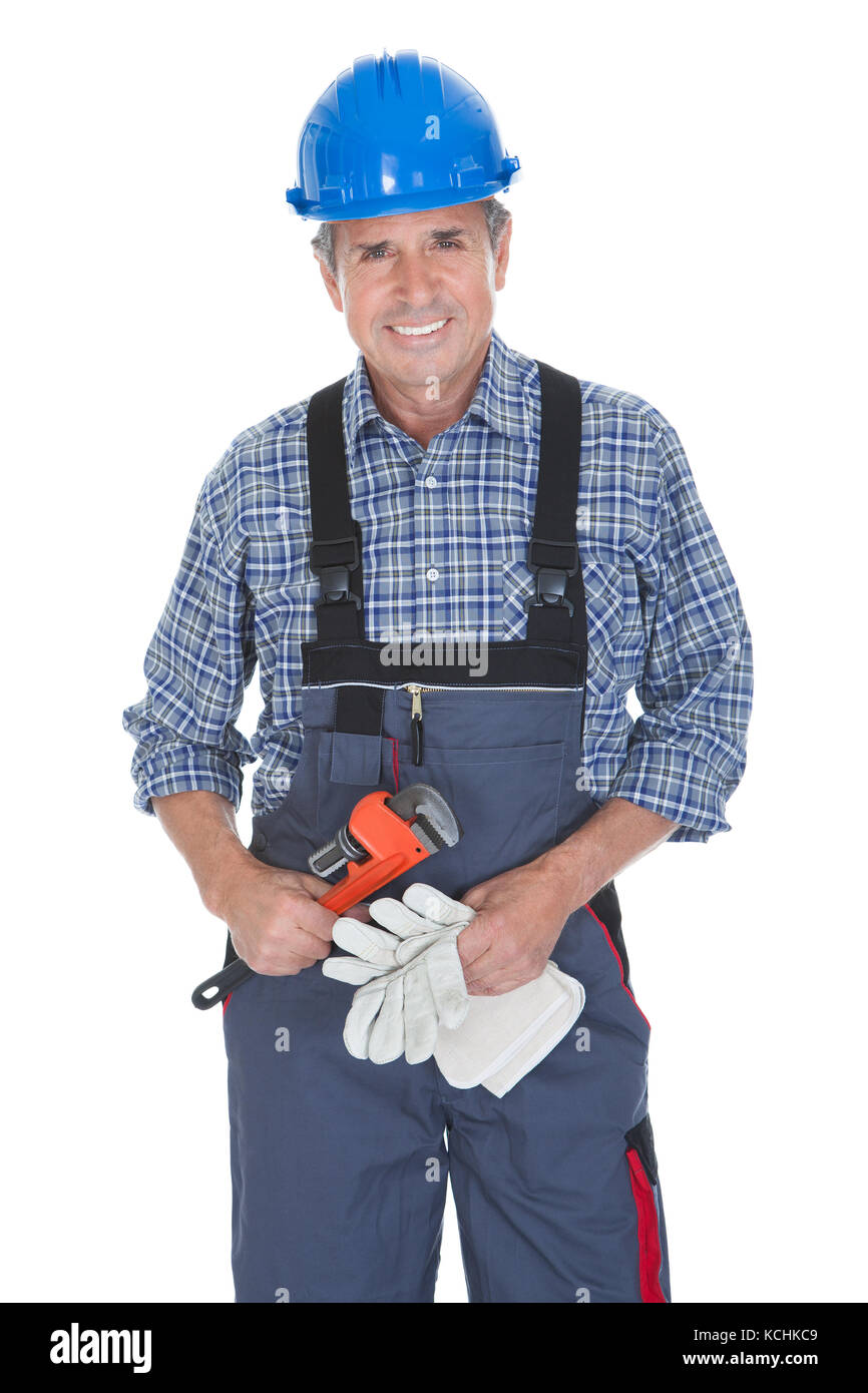 Portrait Of Male Worker Holding Wrench Over White Background Stock ...