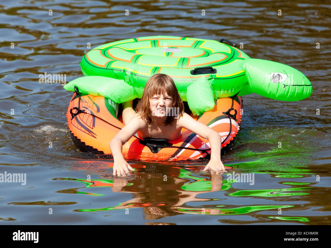 Boy Having Fun on Inflatable Rubber Boat in Summer Stock Photo - Alamy