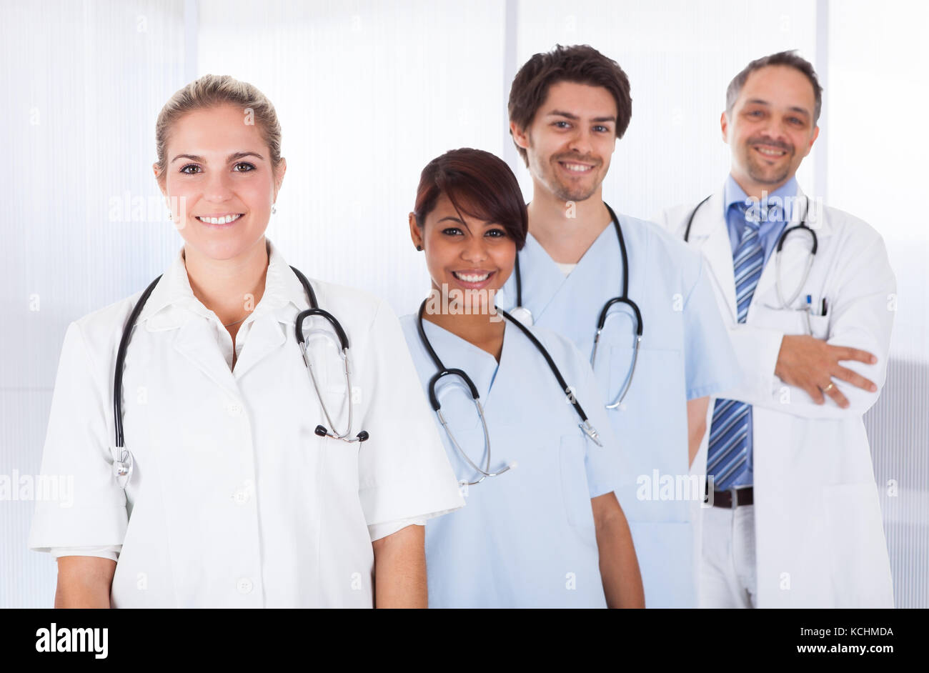 Group Of Happy Doctors Standing In A Row With Stethoscope Stock Photo ...