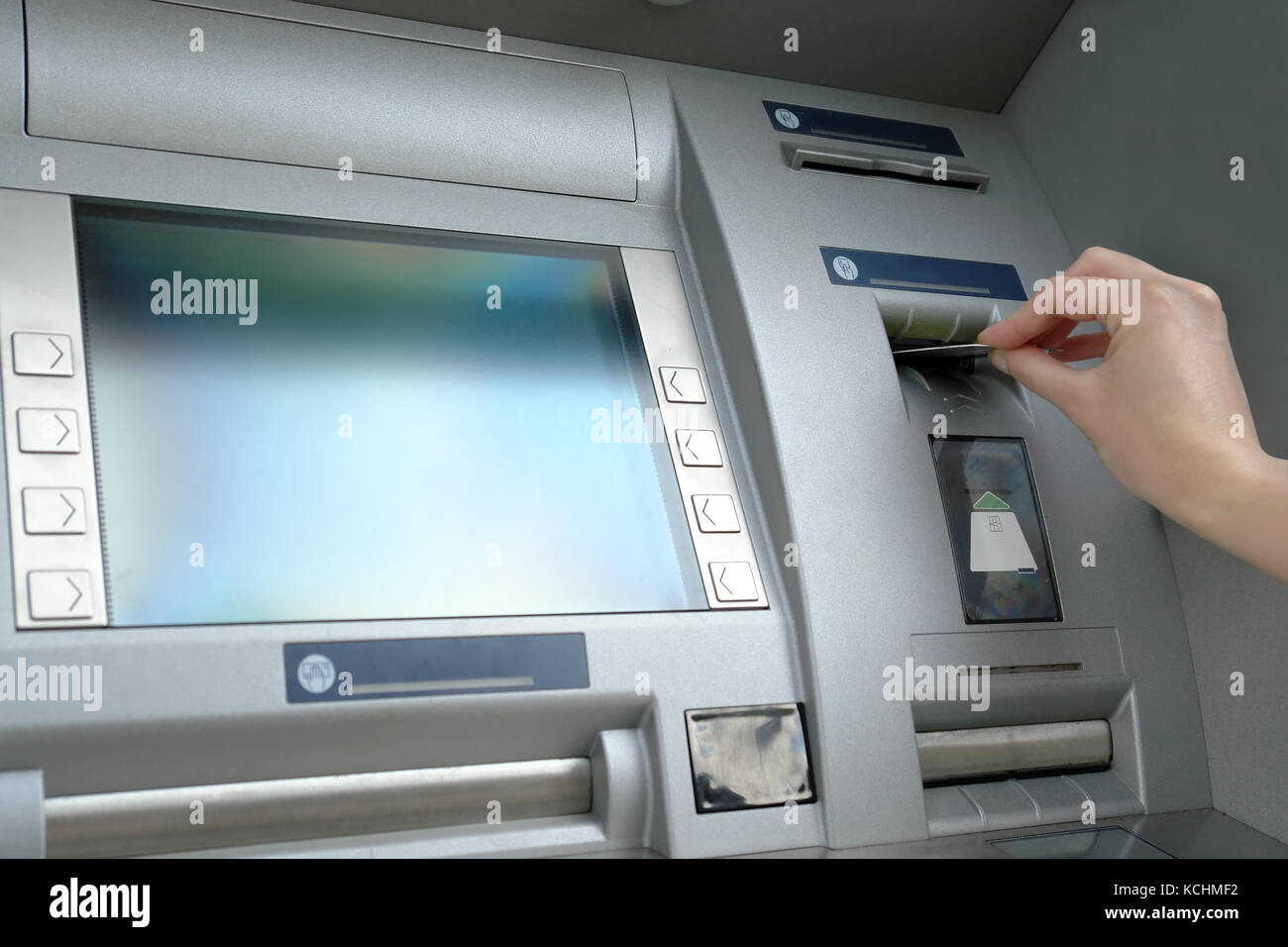 Insert credit card into an atm machine cash bank teller hi-res stock ...