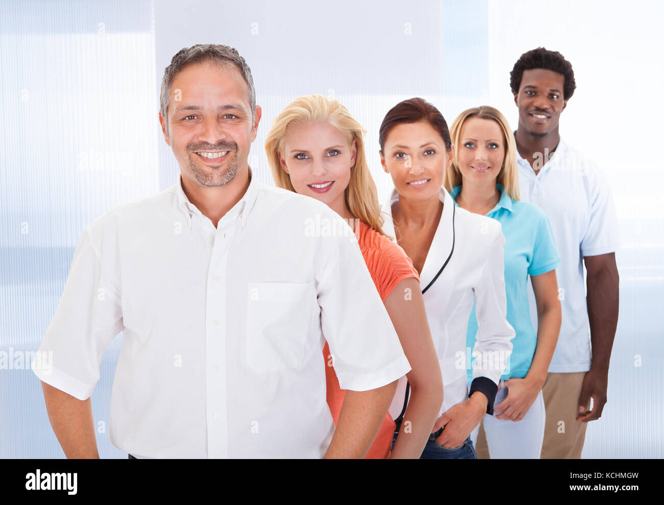 Men standing in a line hi-res stock photography and images - Alamy