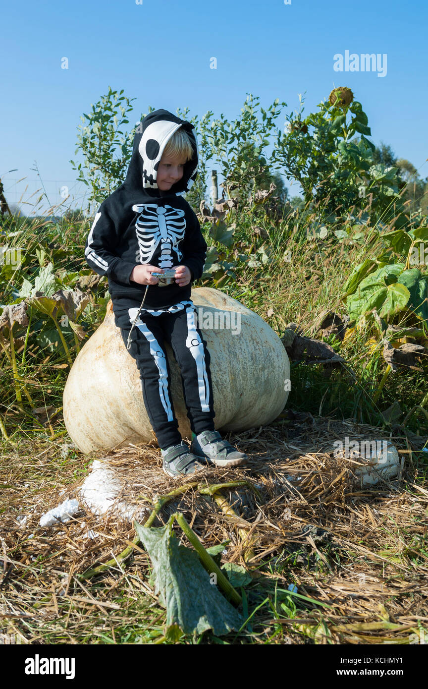 Boy wearing skeleton costume Stock Photo - Alamy