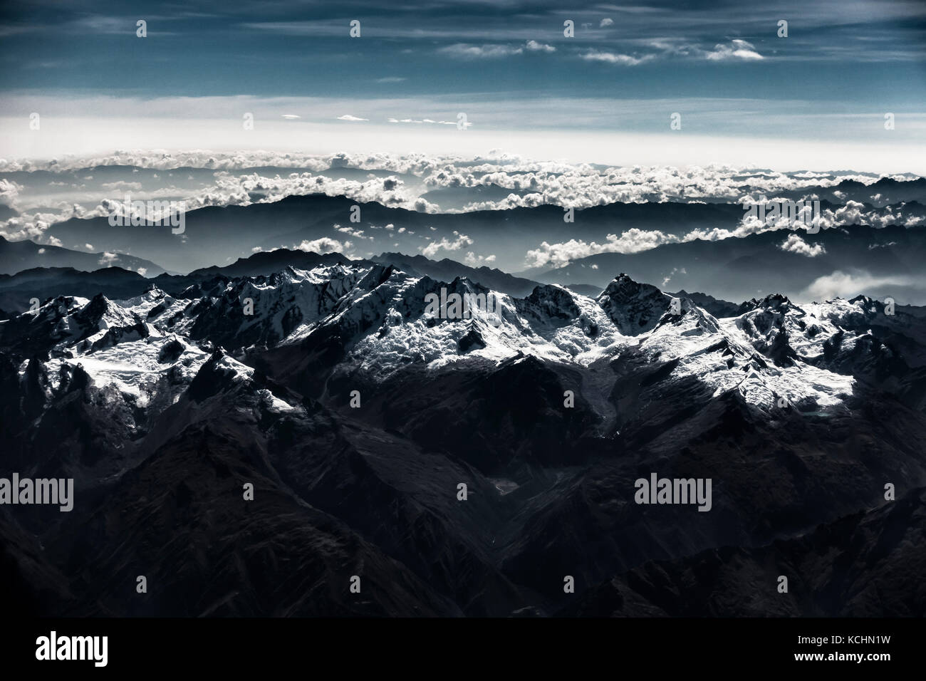An aerial view of the snow capped Peruvian Andes, shot from an airplane ...
