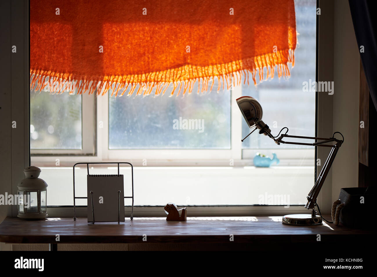 High countertop window sill, table lamp.A cozy place for reading Stock ...