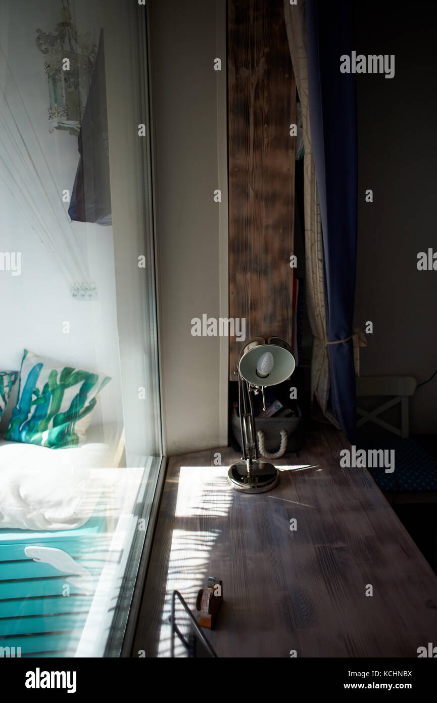 High countertop window sill, table lamp.A cozy place for reading Stock ...