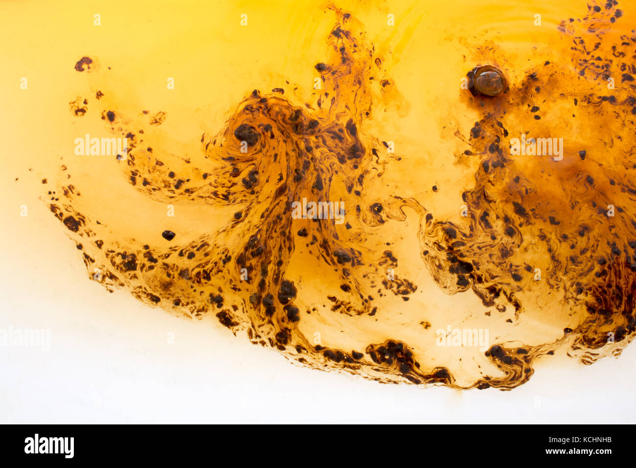 Coffe slowly dissolve in the hot water Stock Photo - Alamy