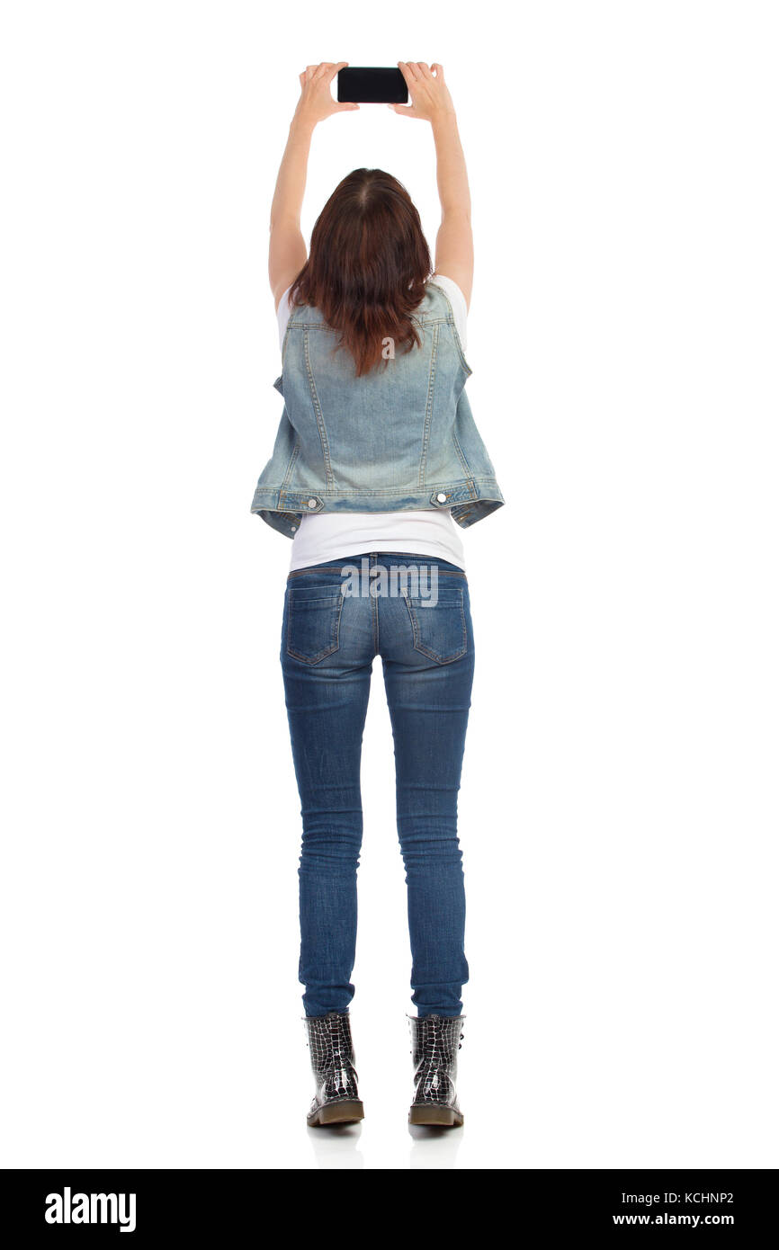 Woman and phone rear view Cut Out Stock Images & Pictures - Alamy