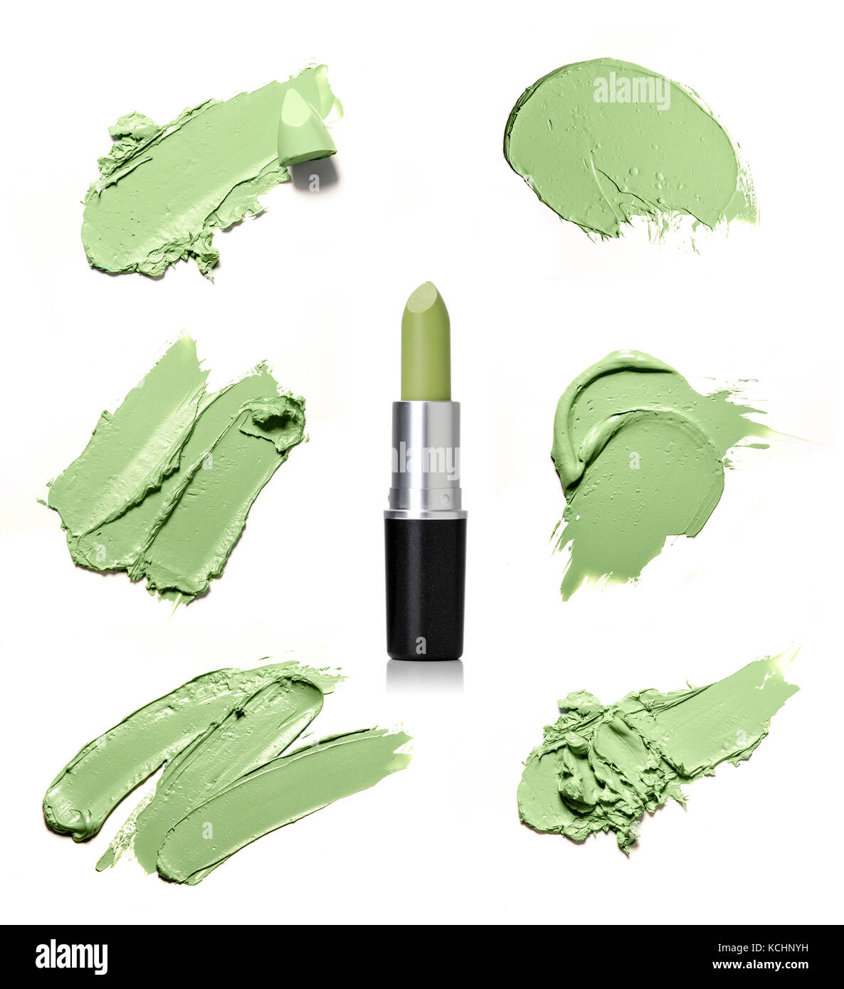 cosmetic products smear paint of crushed Green Lipstick on a white ...