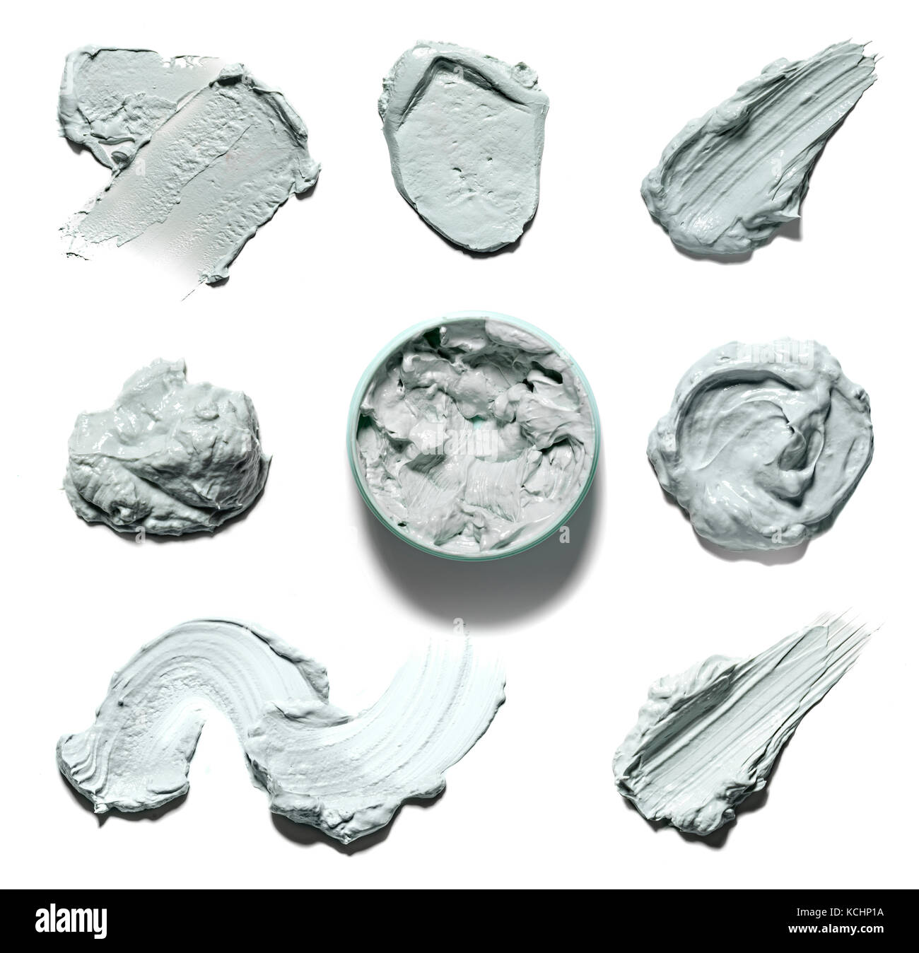 Various smear of facial mud on a white background Stock Photo - Alamy