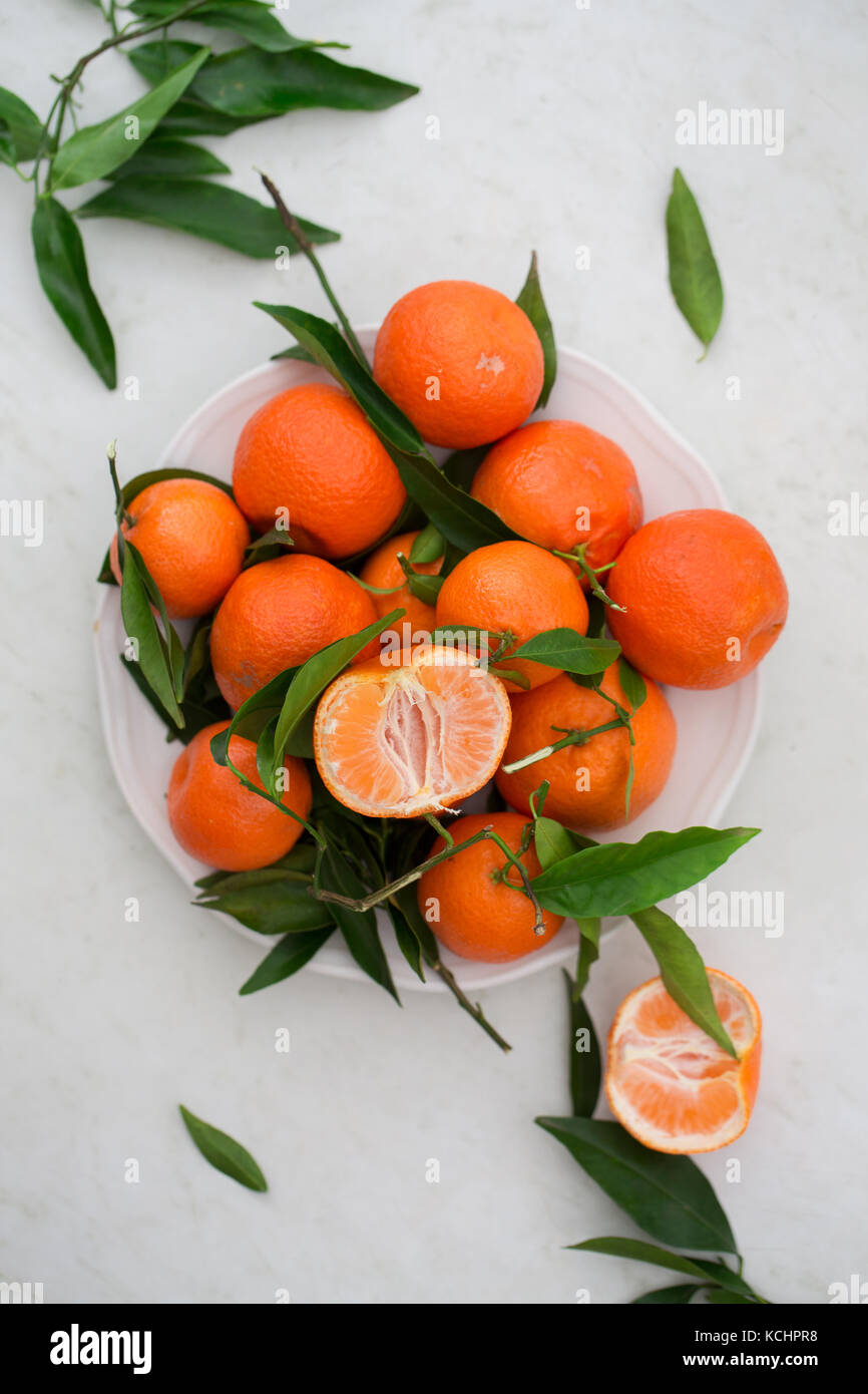 juicy mandarins on a plate Stock Photo - Alamy