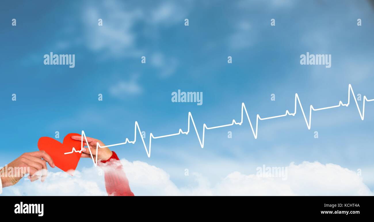 Digital composite of Heart beat over hands holding heart in clouds ...