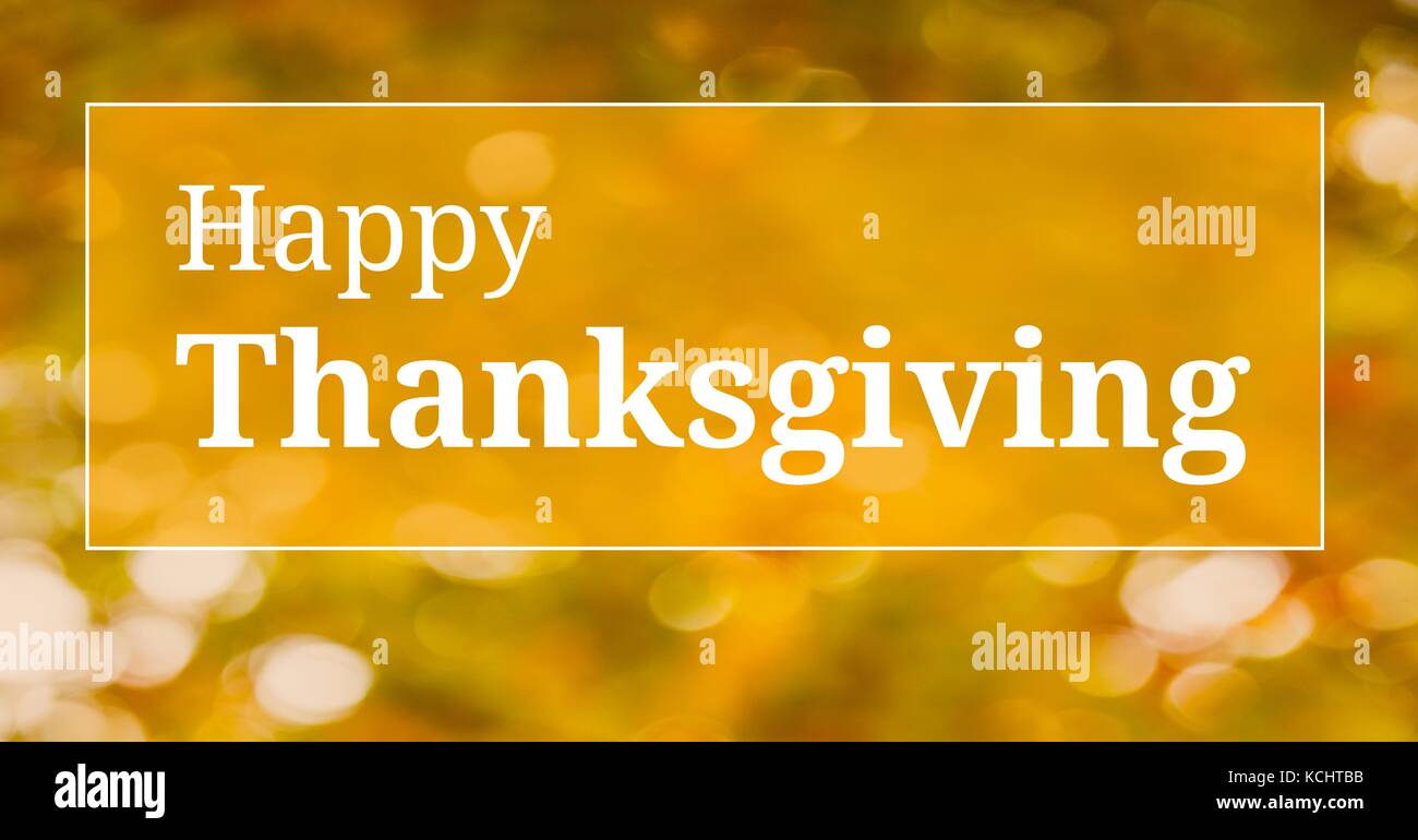 Digital composite of Happy thanksgiving text with warm yellow leaves ...
