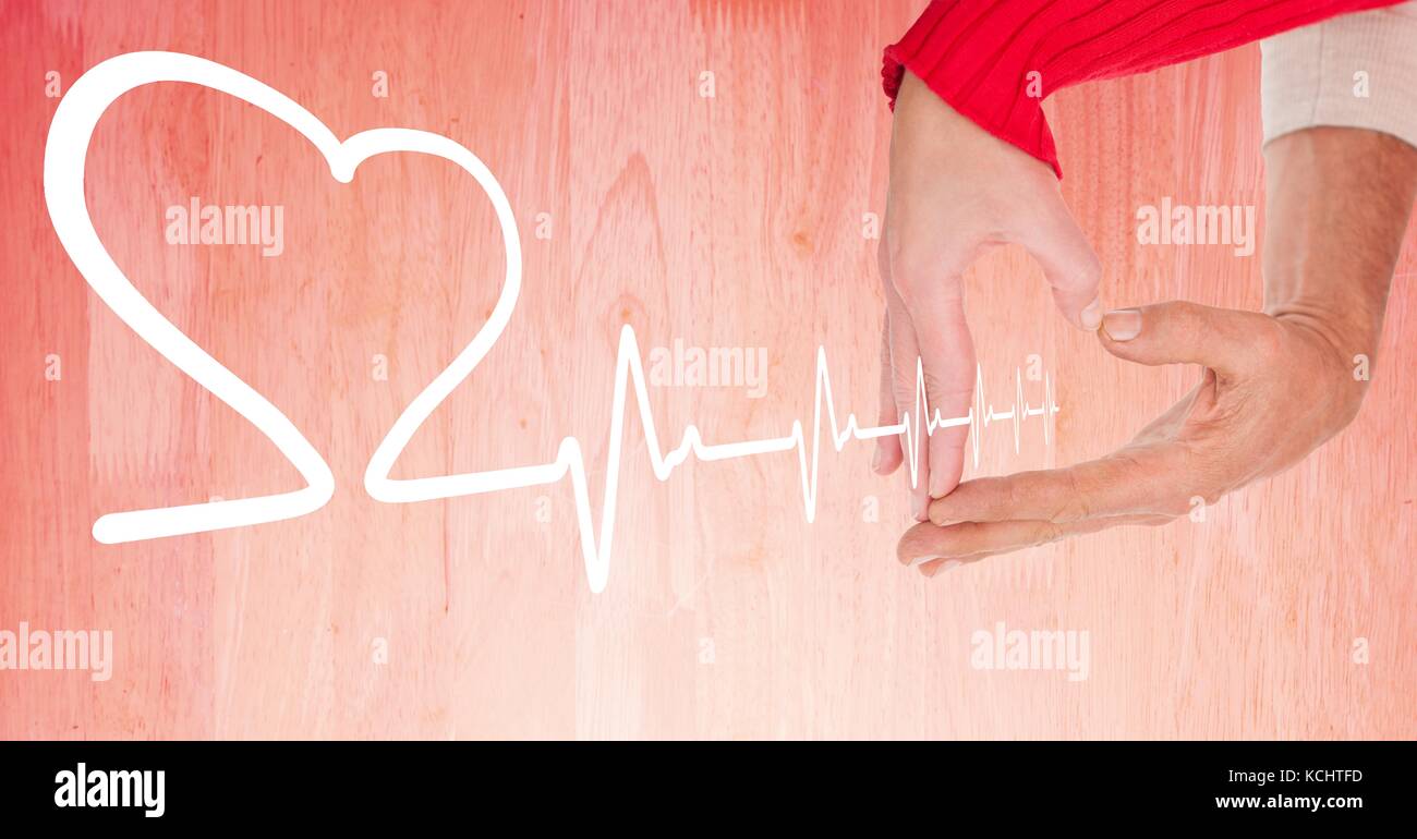 Digital composite of Heart beat over hands holding heart Stock Photo ...