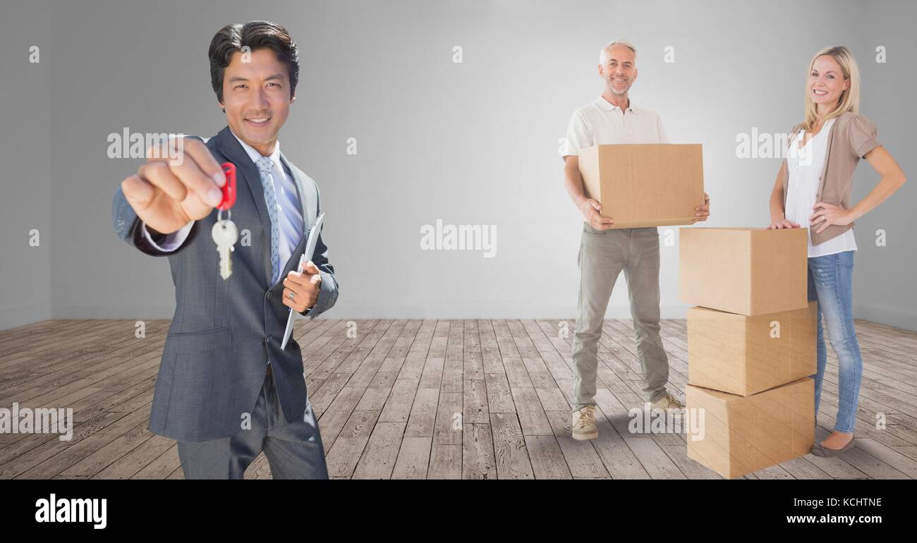 Digital composite of people moving boxes into new home with key Stock ...
