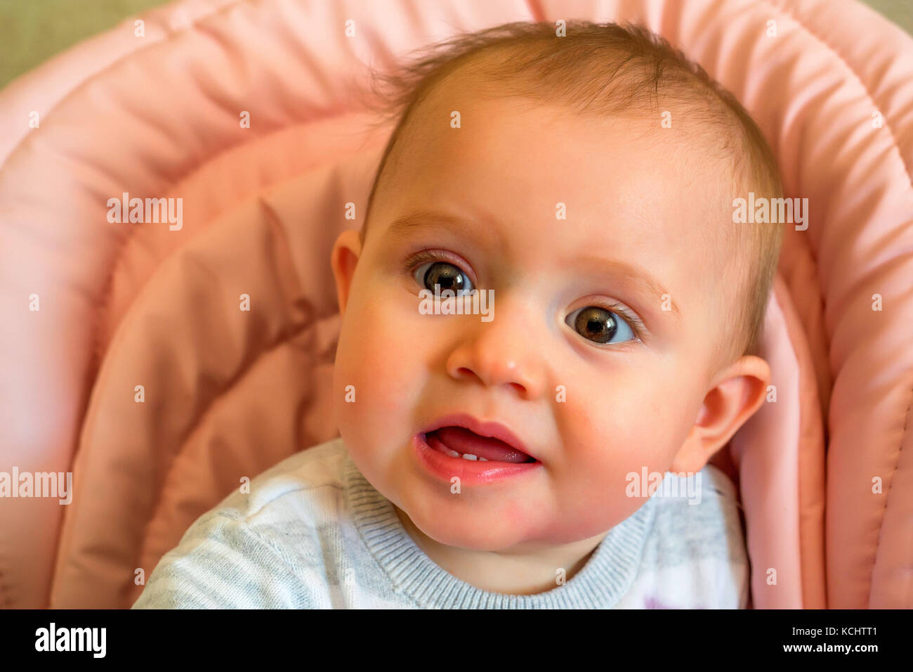 Curious baby while being feeded Stock Photo - Alamy Curious baby while being feeded Stock Photo - Alamy