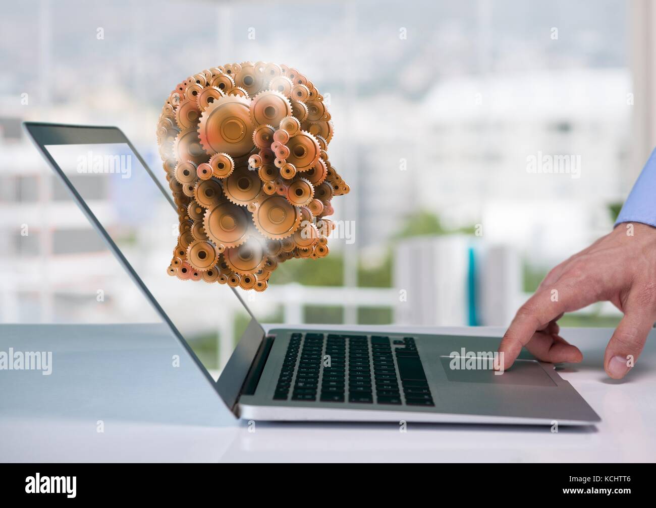 Digital composite of 3d head made of cogs poping out of laptop screen ...