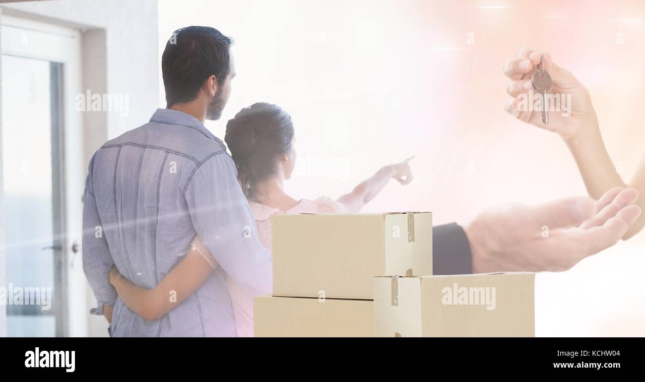 Digital composite of people moving boxes into new home with keys Stock ...
